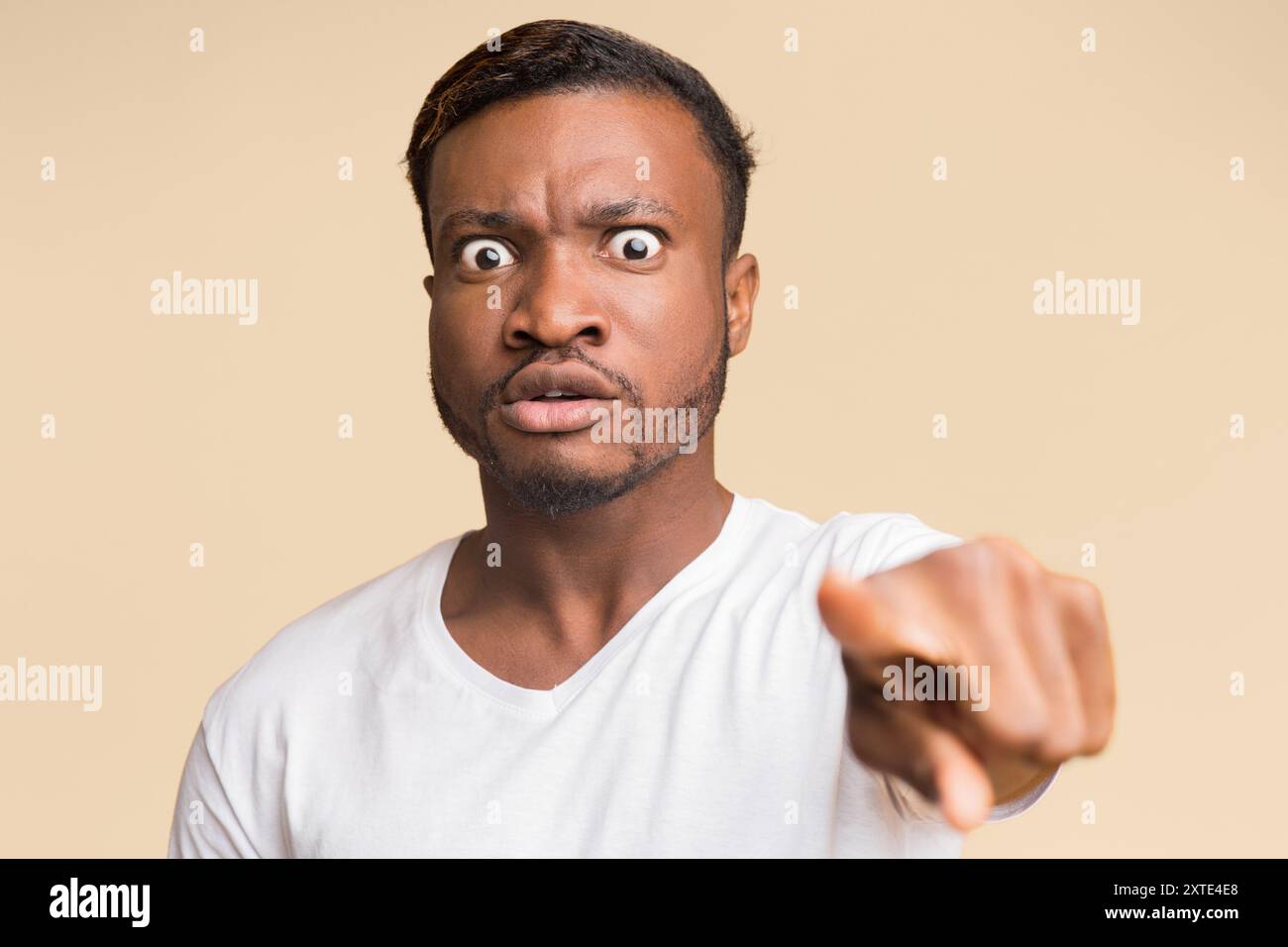Mad African American Man Pointing Finger At Camera, Yellow Background ...