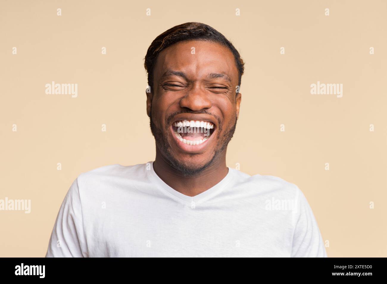Portrait Of Laughing Black Man Standing Over Yellow Background, Studio ...