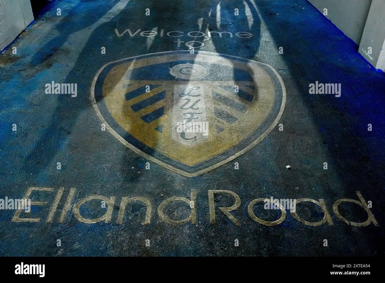 Fans shadows are cast on the Leeds United badge ahead of the Carabao ...