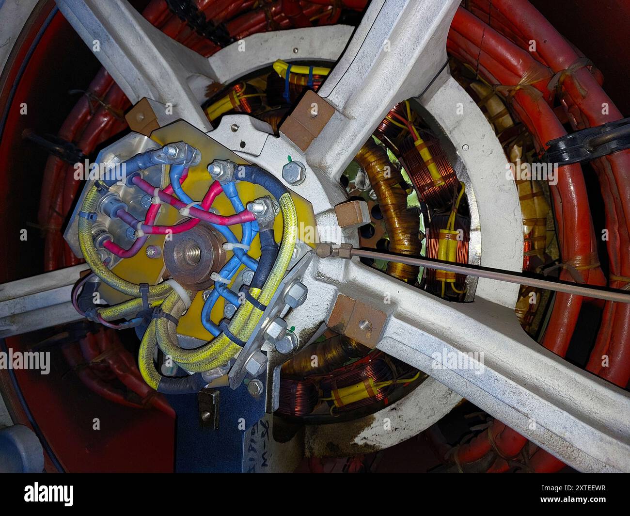 The alternator’s windings and connections are prominently displayed ...