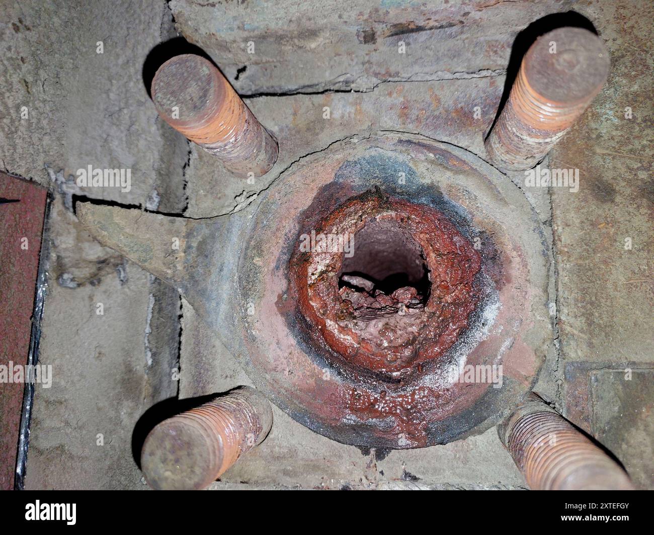 The cast iron steam boiler economizer displays heavy sediment buildup ...