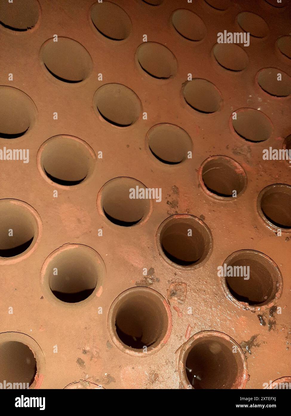 The interior of a steam boiler drum displays numerous rolled tubes ...