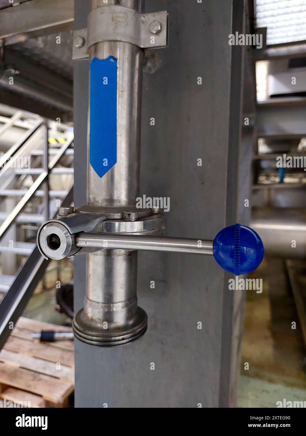 The stainless steel pipe features a disc valve with a nut connection ...