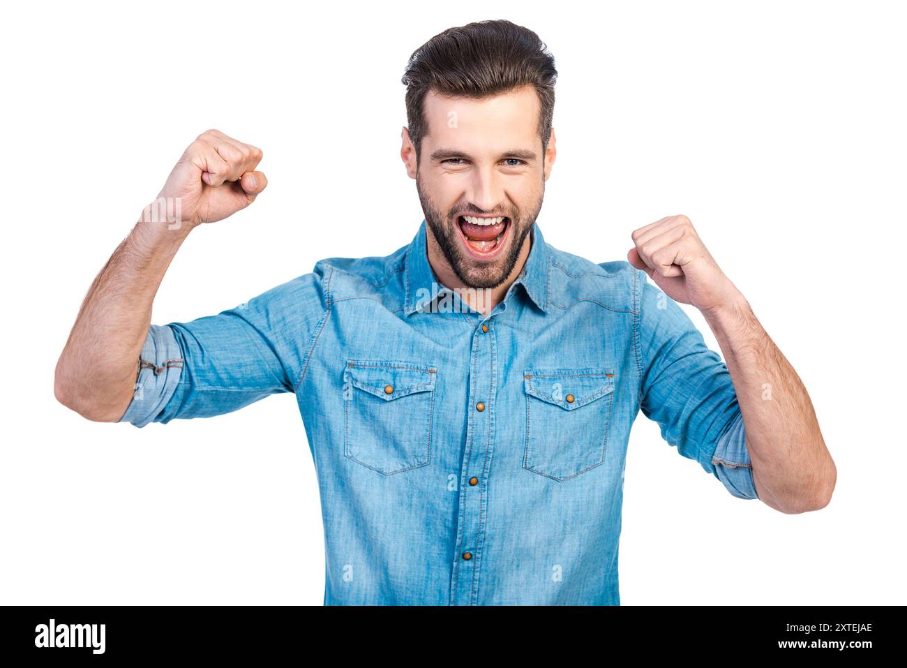 Happy winner. Happy young handsome man gesturing and keeping mouth open ...