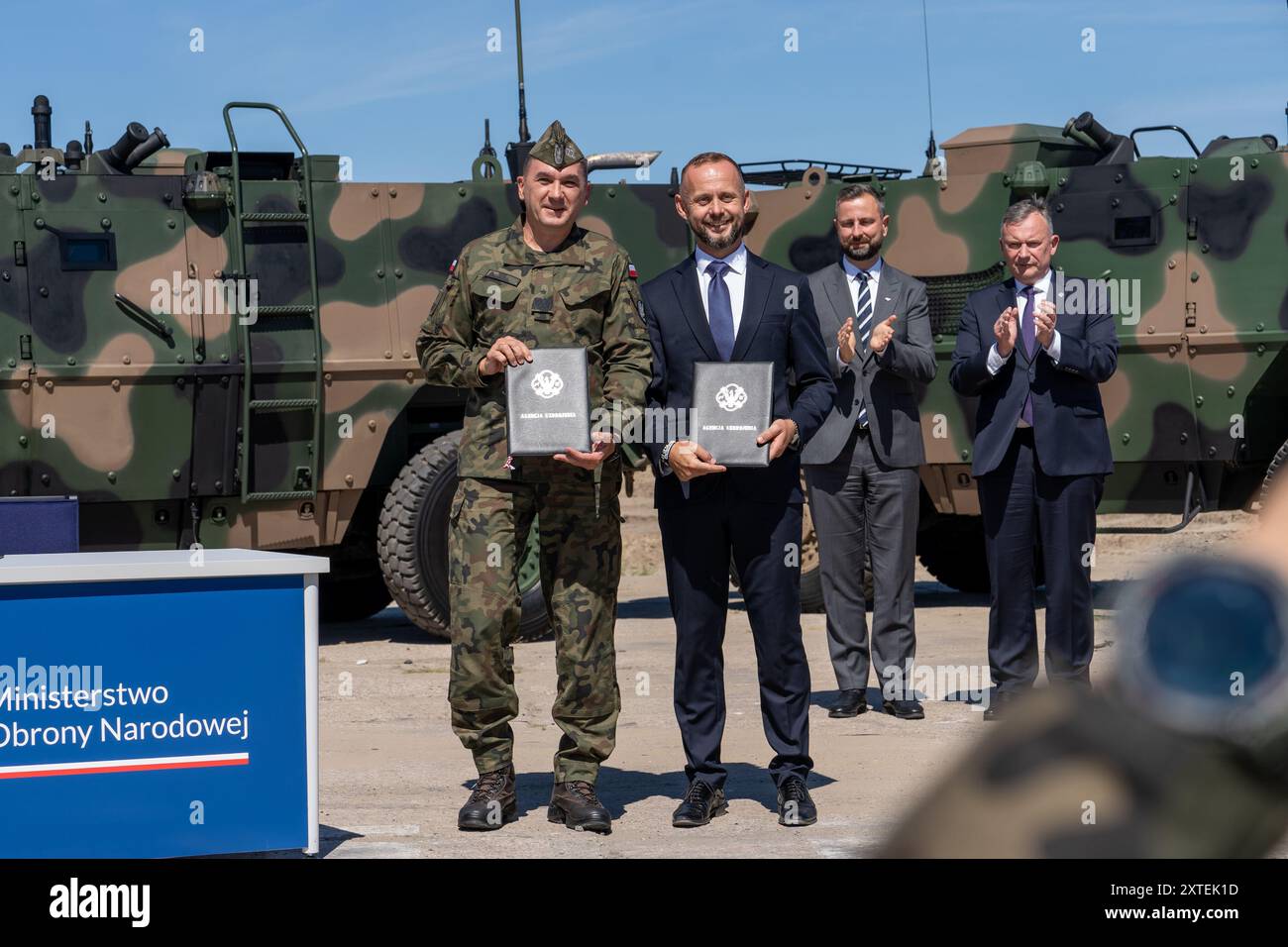 Brigadier General. Artur Kuptel and Dariusz Fabisiak display the signed ...