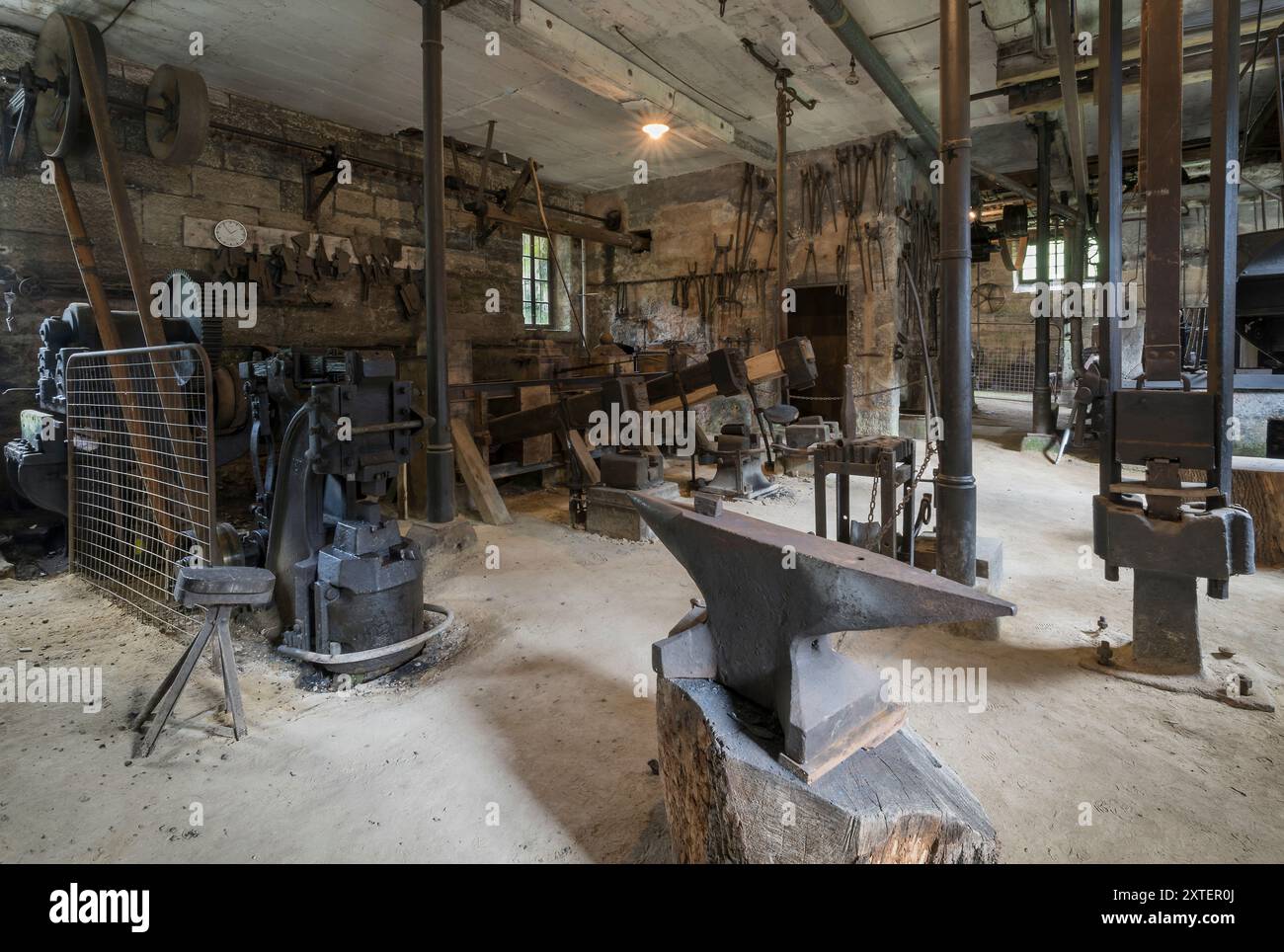Workshop of a historic hammer mill smithy Stock Photo - Alamy