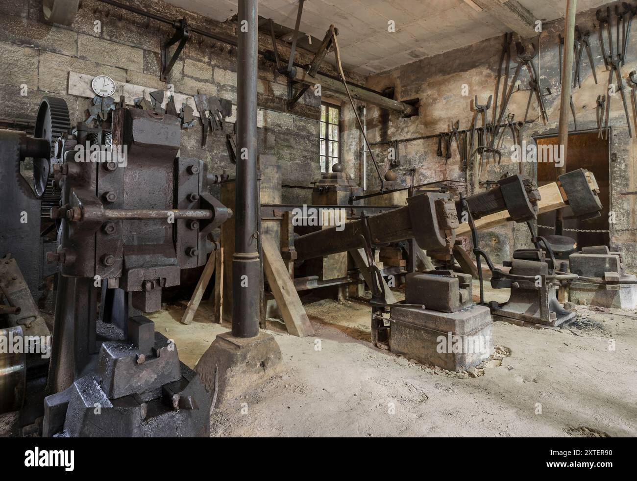 Workshop of a historic hammer mill smithy Stock Photo - Alamy
