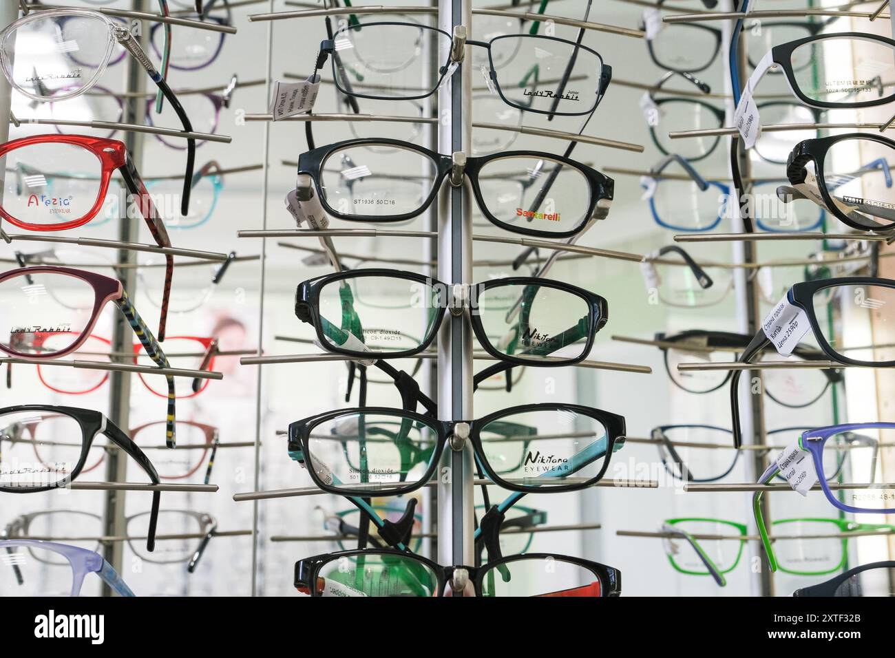 optics shop Fashion glasses on display on the shelf of the optical mall ...
