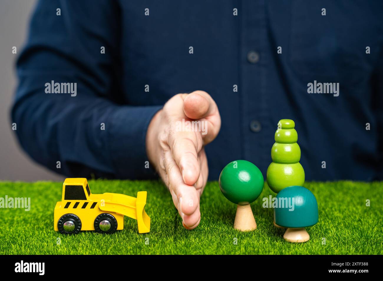 A man stops a bulldozer from cutting down trees. Stop the forest from ...