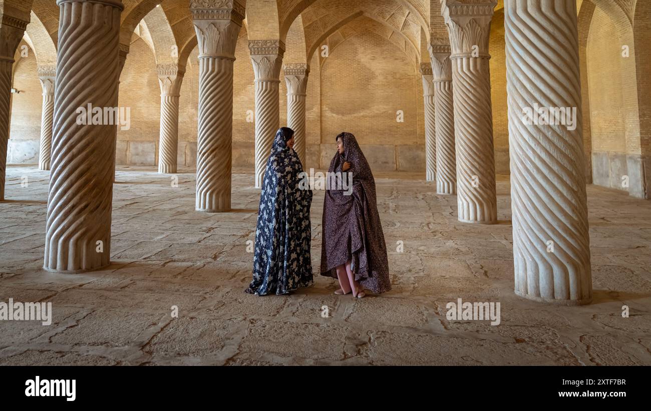 Shiraz, Iran - 4 May 2019: Two Iranian women talking in prayer hall of ...