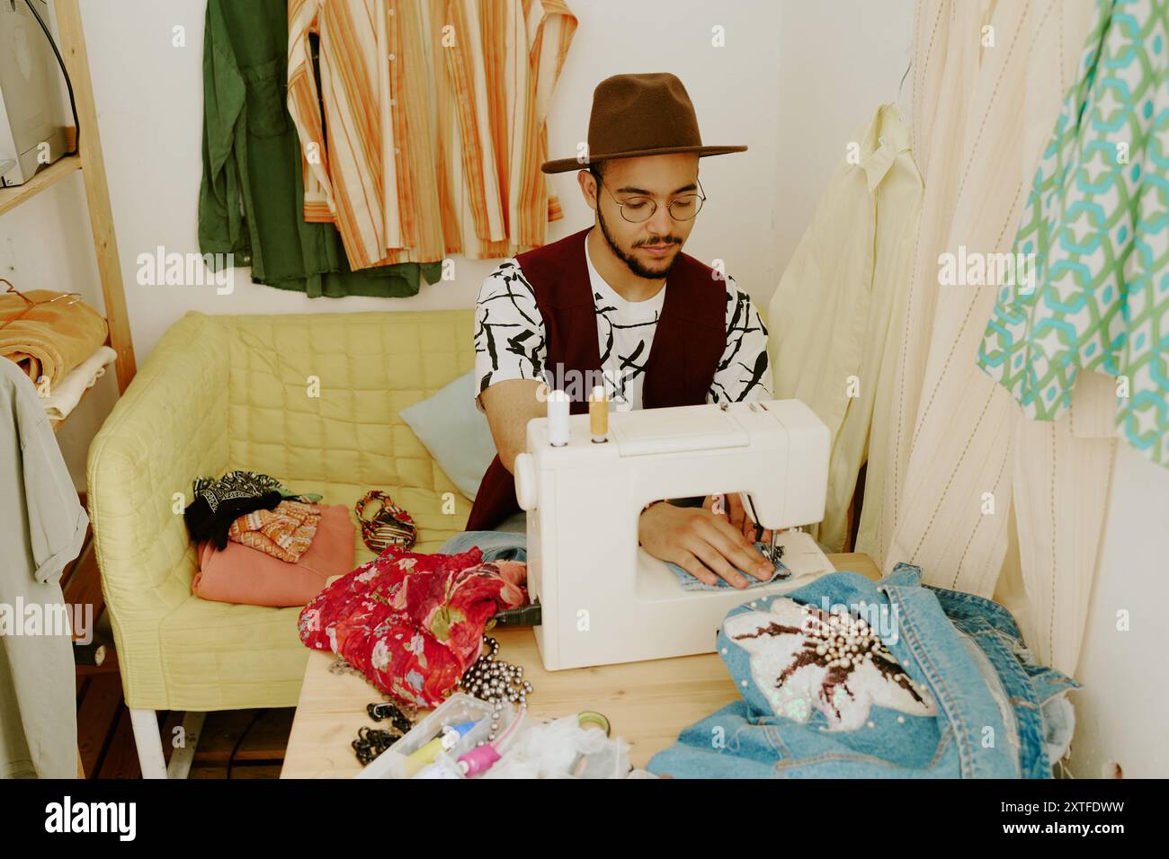 Mend clothes man hi-res stock photography and images - Alamy