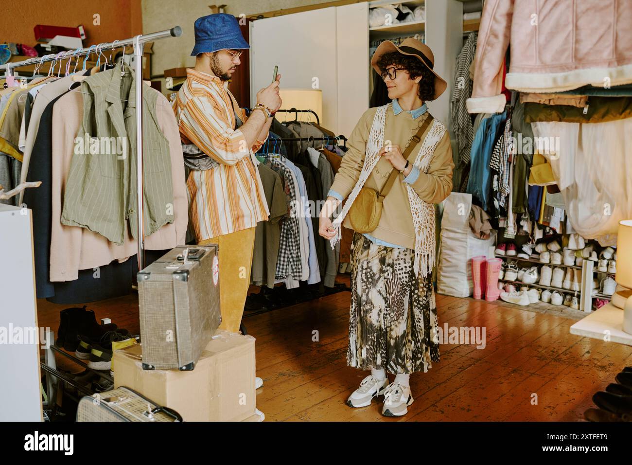 Capturing Fashion Styles in a Vintage Store Setting Stock Photo - Alamy