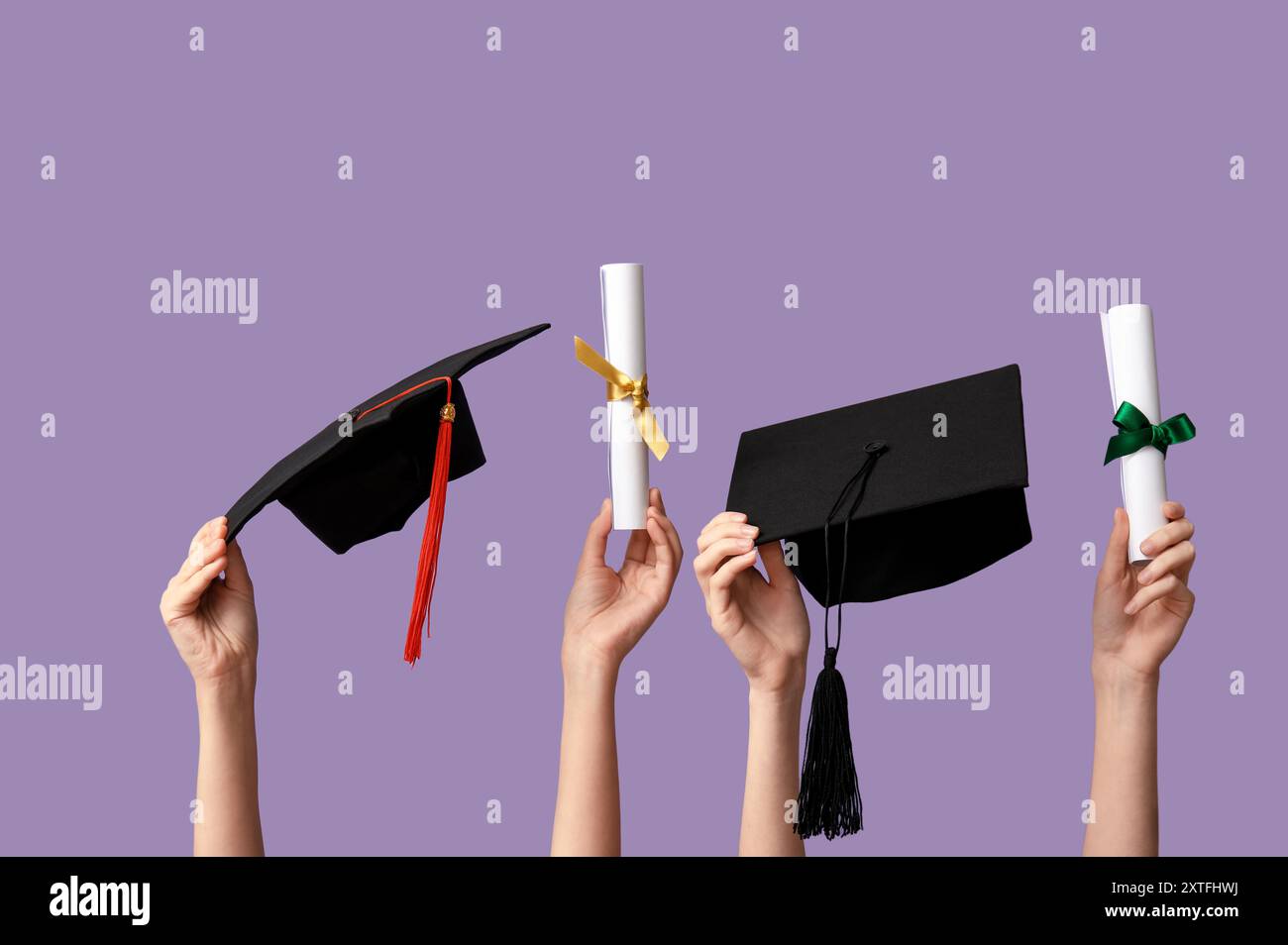 Female hands with graduation hats and diplomas on lilac background ...