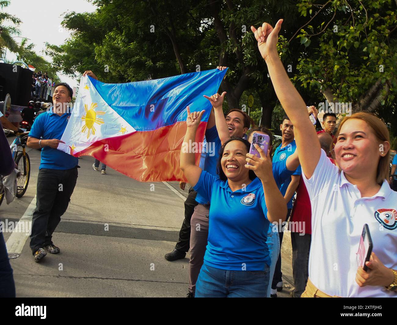 Manila, Philippines. 14th Aug, 2024. Filipino supporters waving their ...