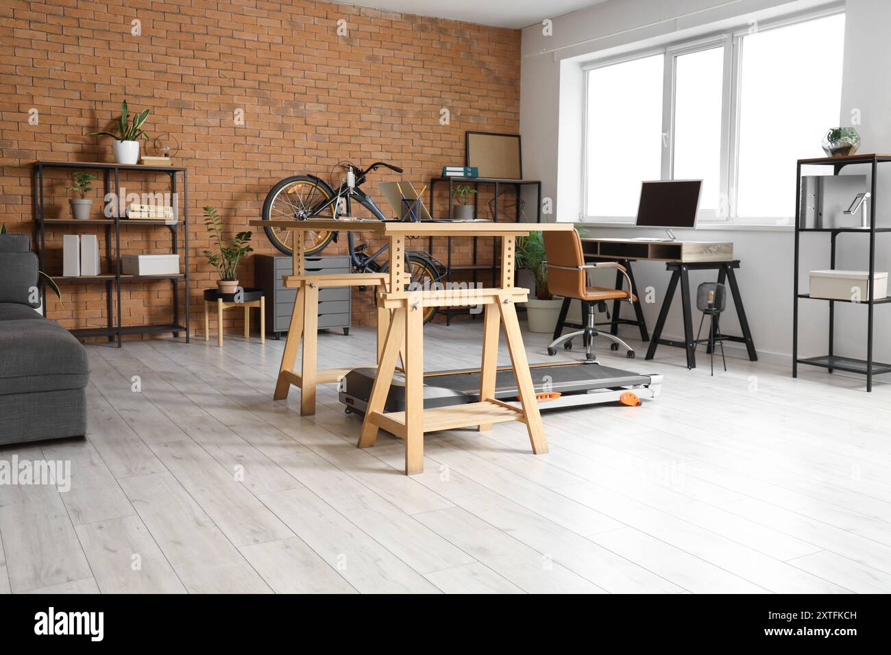 Interior of modern office with desks, treadmill and bicycle Stock Photo ...