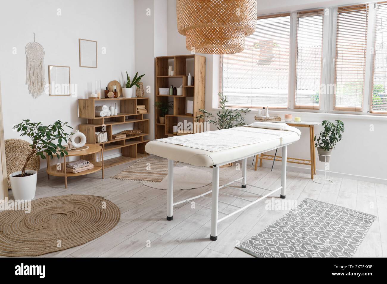 Interior of spa salon with couch, tables and shelf units Stock Photo ...