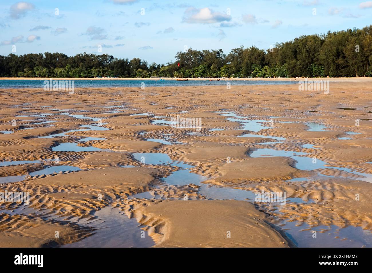Sandy beach at low tide. Sand of tropical sea and shallow water, view ...