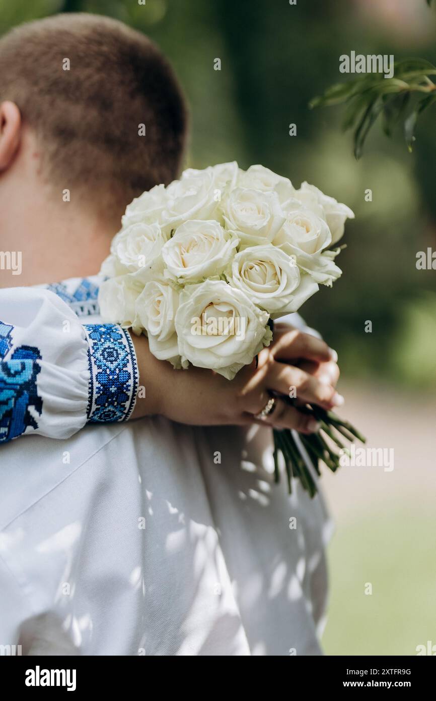 Romantic embrace at a traditional Ukrainian wedding, symbolizing love ...