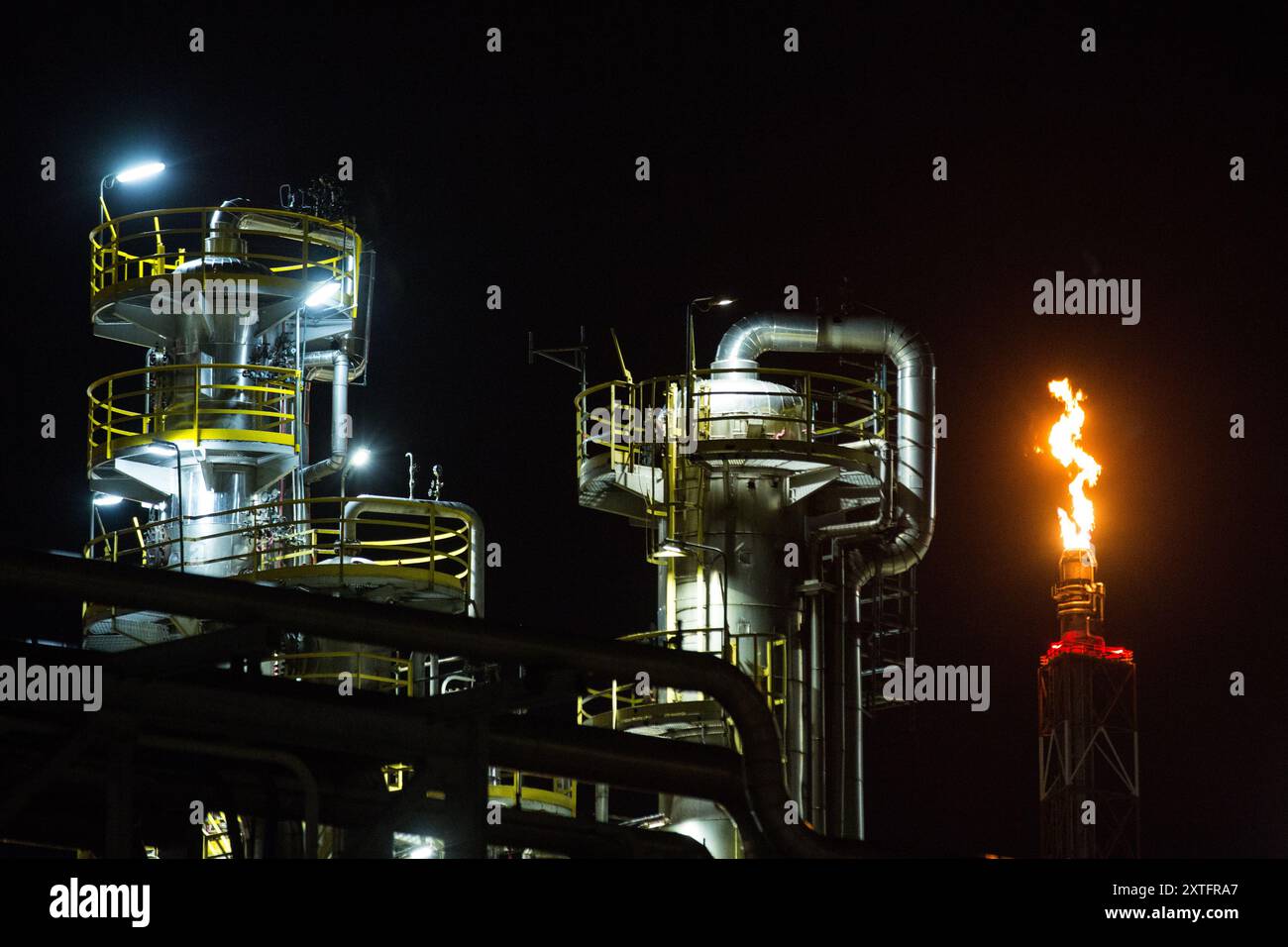 Flame seen coming from the chimney of the PKN Orlen oil refinery. The ...