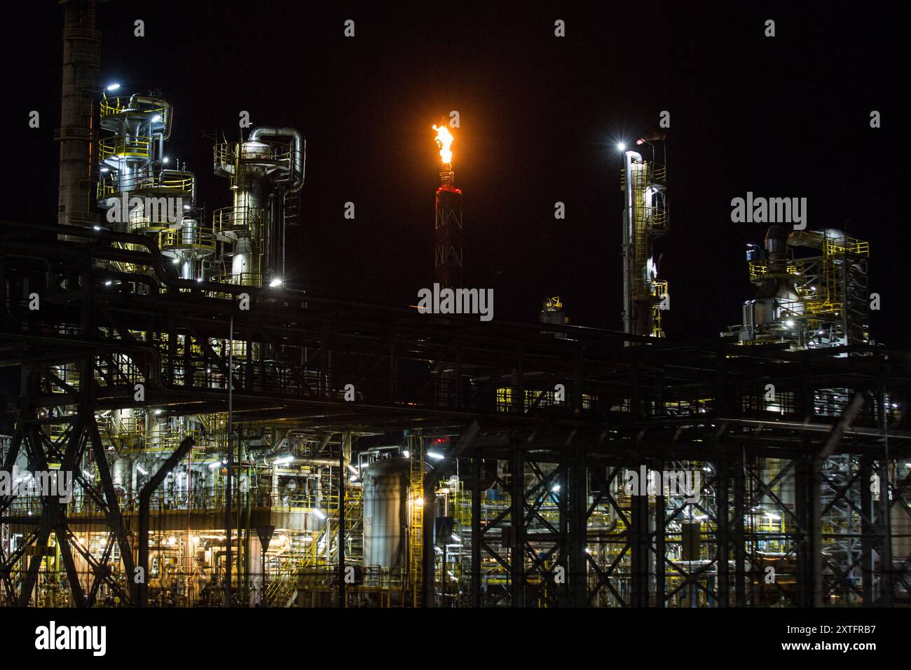 Flame seen coming from the chimney of the PKN Orlen oil refinery. The ...