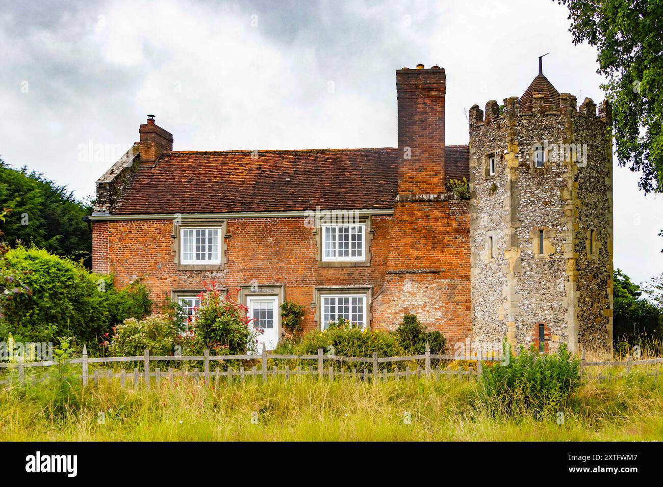 A charming old English countryside house with a red brick exterior ...