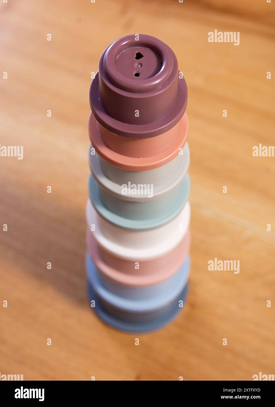 Childrens toy plastic cup pyramid made of multicolored elements Stock ...