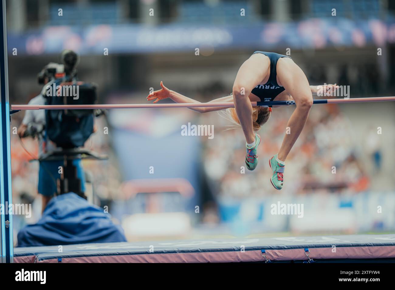 Elena Kulichenko participating in the high jump at the Paris 2024 ...