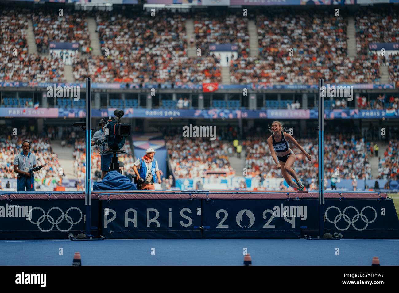 Elena Kulichenko participating in the high jump at the Paris 2024 ...