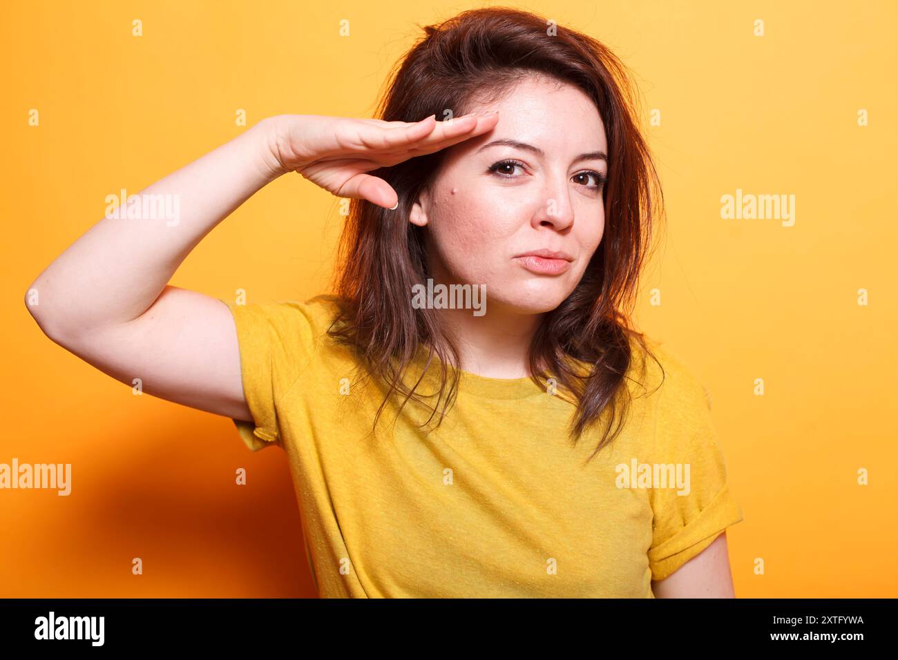Woman hand forehead salute hi-res stock photography and images - Alamy