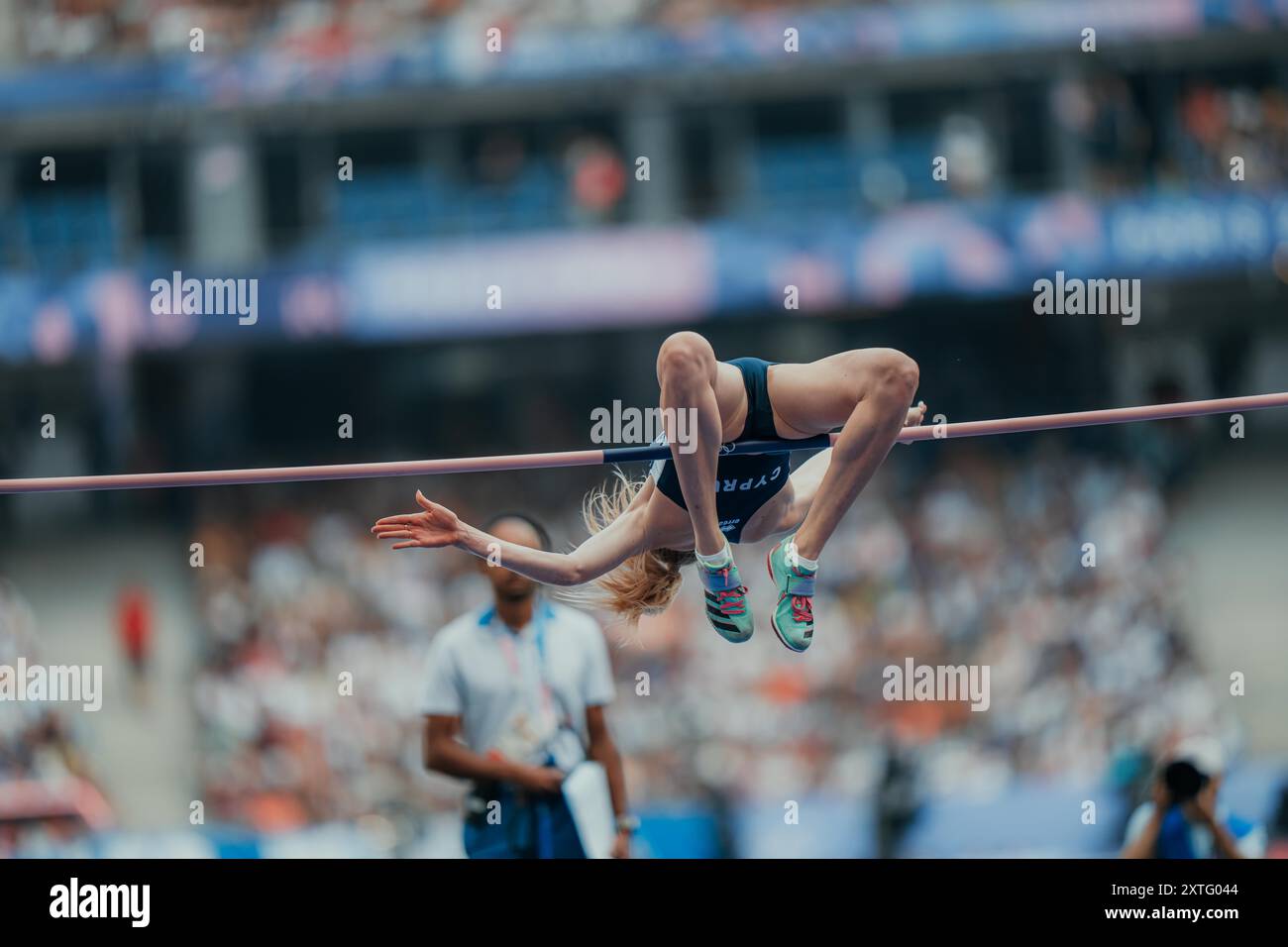 Elena Kulichenko participating in the high jump at the Paris 2024 ...