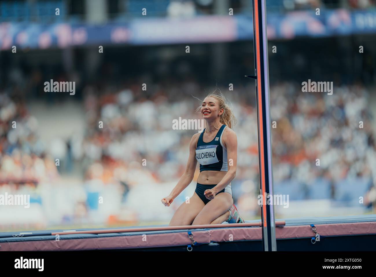 Elena Kulichenko participating in the high jump at the Paris 2024 ...