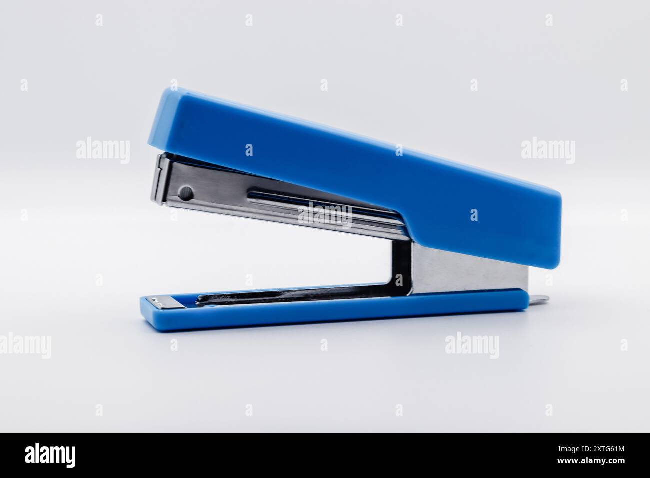 essential object in an office, blue on a white background, stapler ...