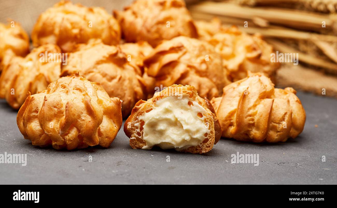 Delicious cream-filled profiteroles, golden and crisp, perfect for a ...