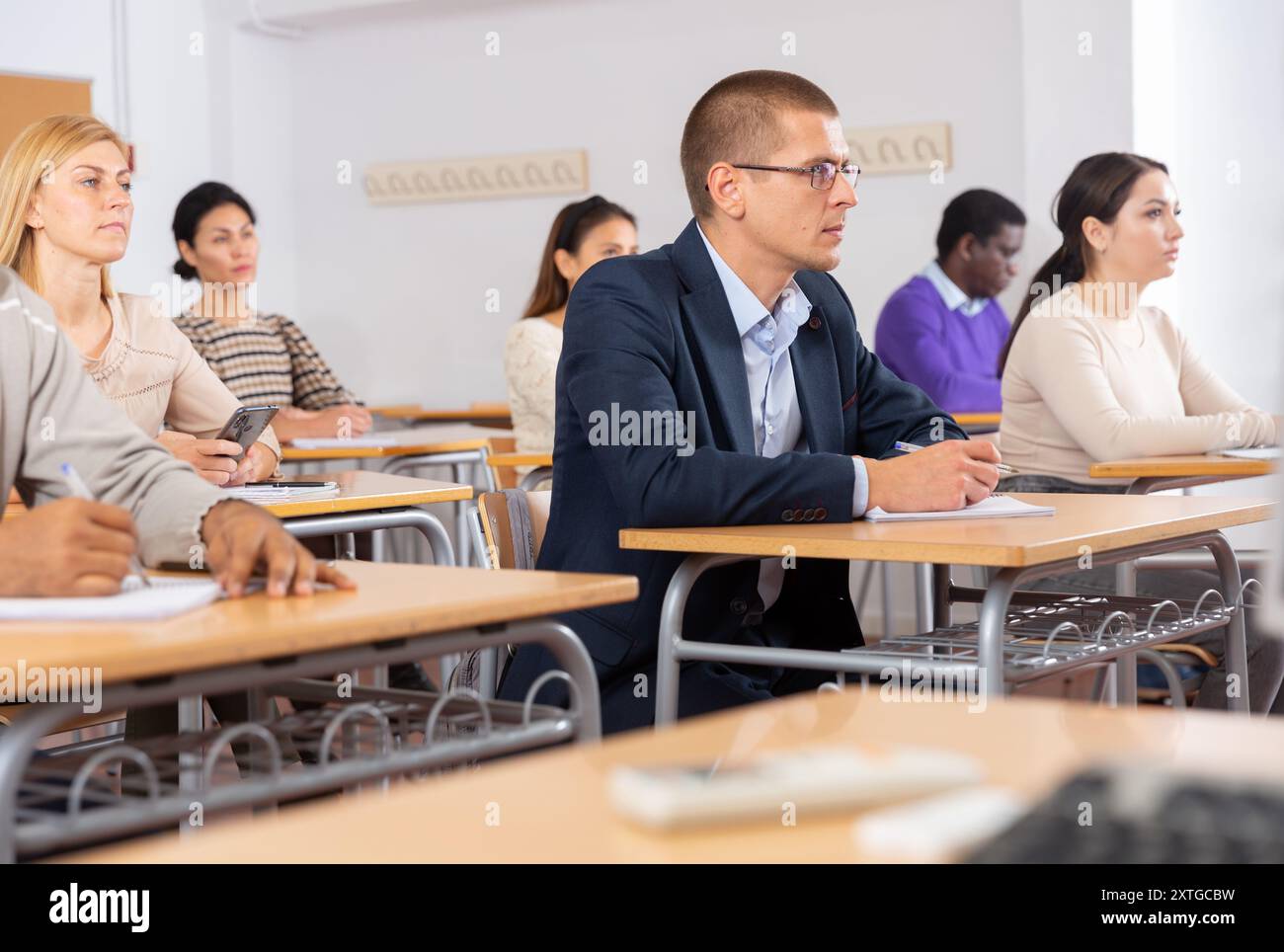Lesson in classroom of the university - students at their desks Stock ...