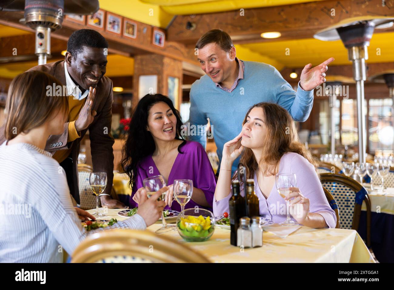 Smiling women at restaurant table hi-res stock photography and images ...