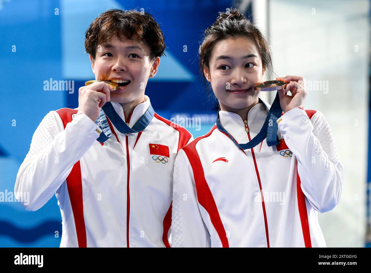 Yiwen Chen of China, gold, and Yani Chang of China, bronze show the medals of the diving 3m ...