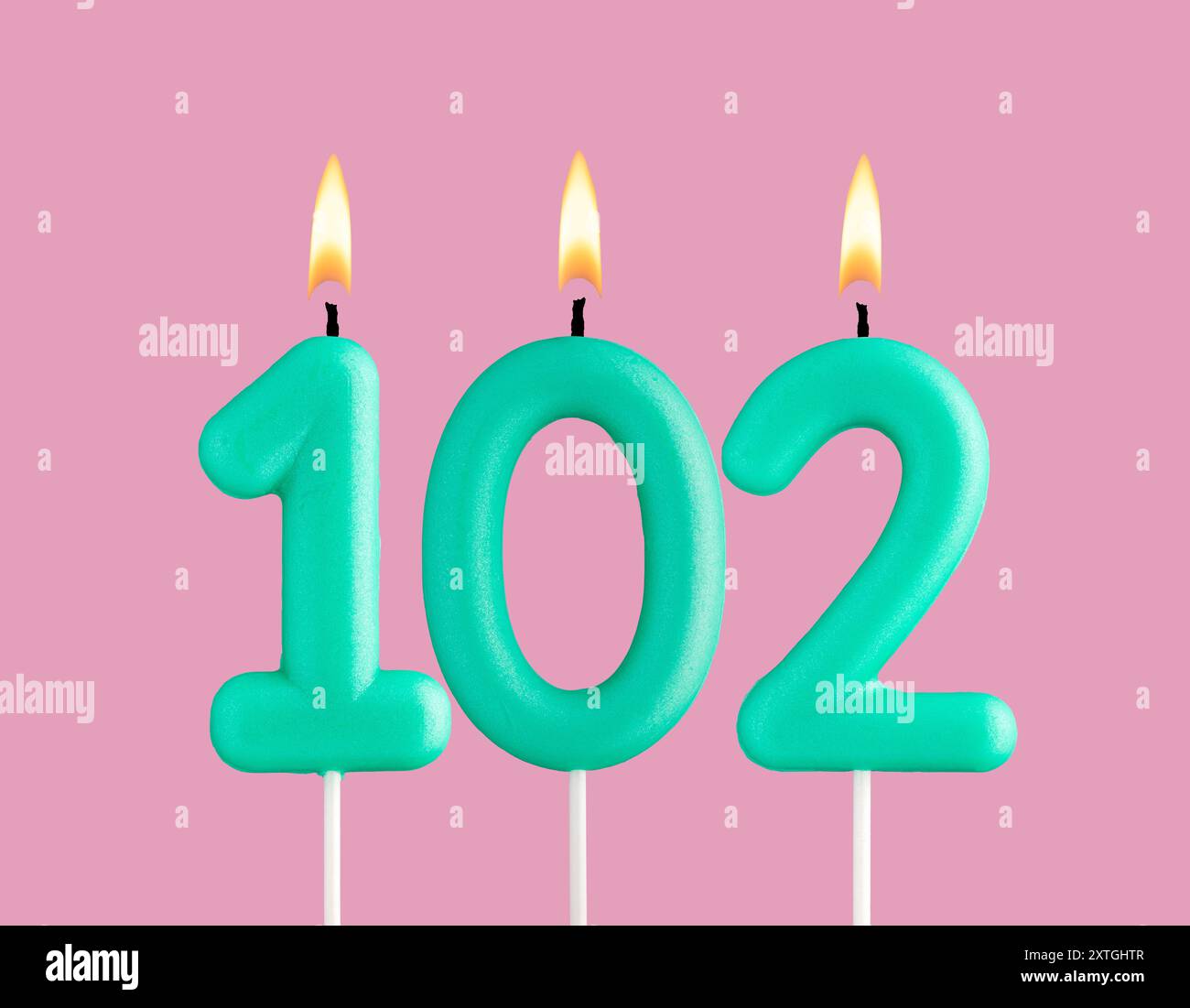 Green candle number 102 - Birthday card on pastel pink background Stock ...