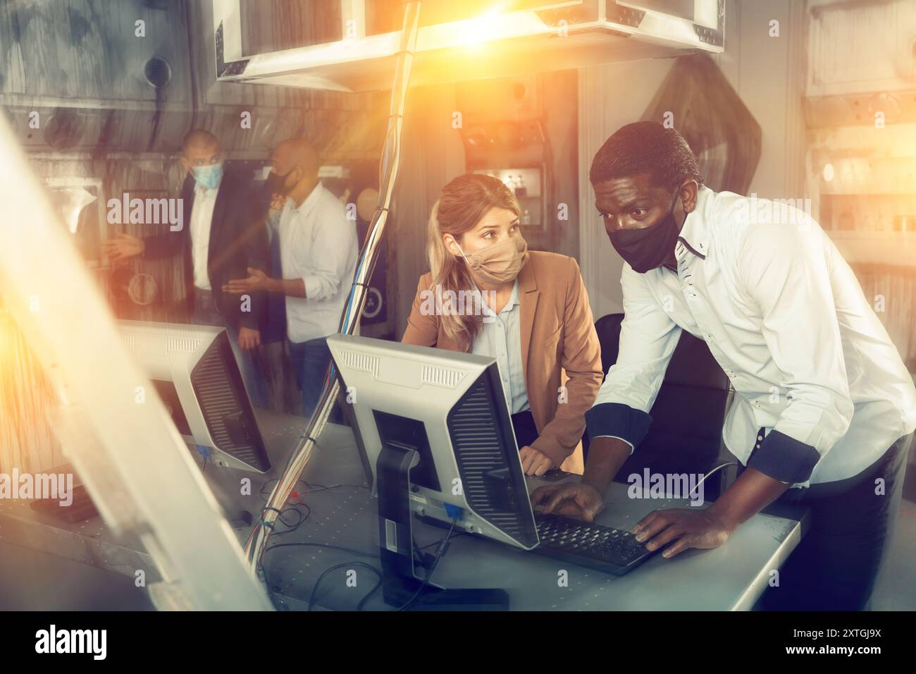 Young people solving conundrum in escape room Stock Photo - Alamy