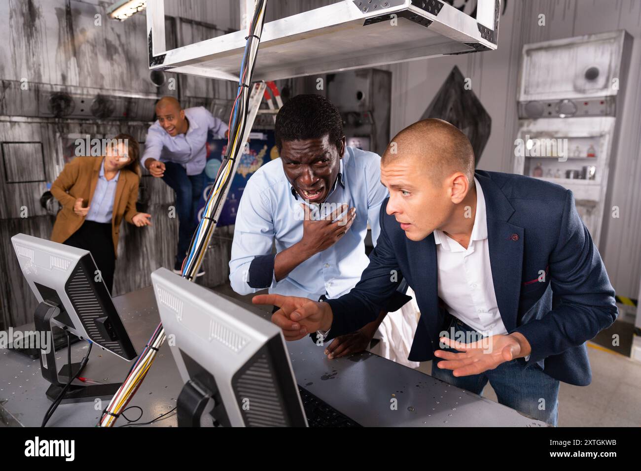 Two men solving puzzle in escape room Stock Photo - Alamy