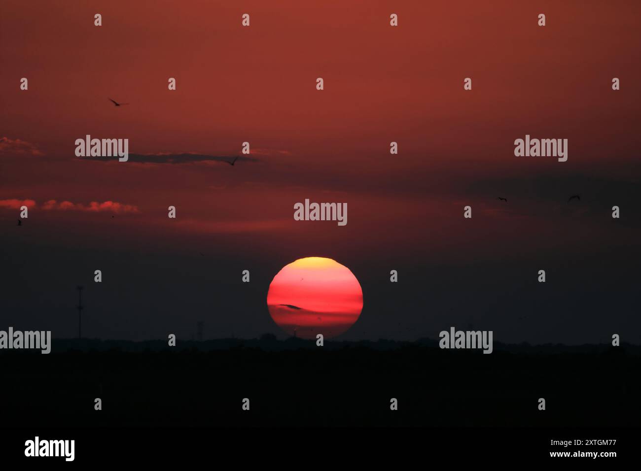 Dipping sun disk Stock Photo - Alamy