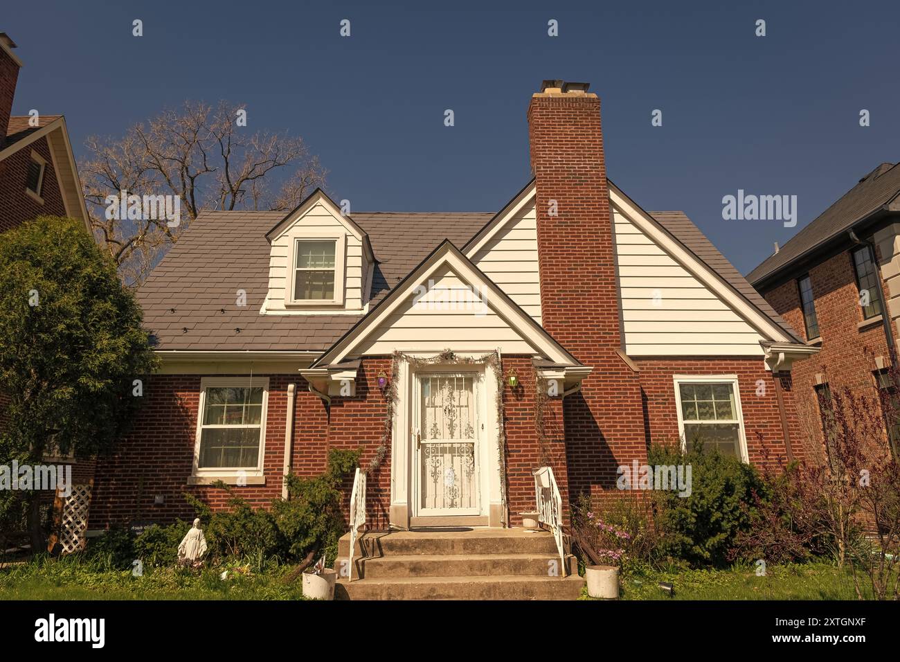 vintage cottage style home in residential neighborhood. neighborhood ...