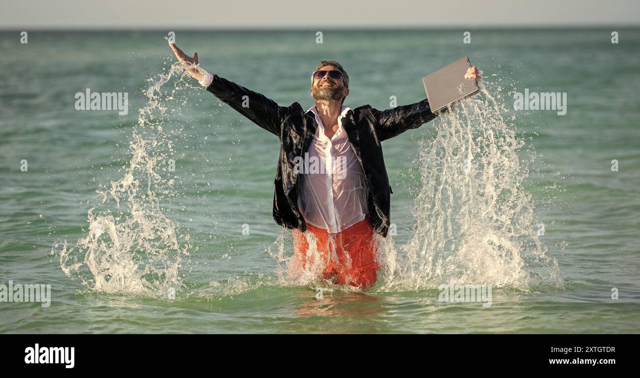 successful happy businessman relaxing at the beach remote workingand ...
