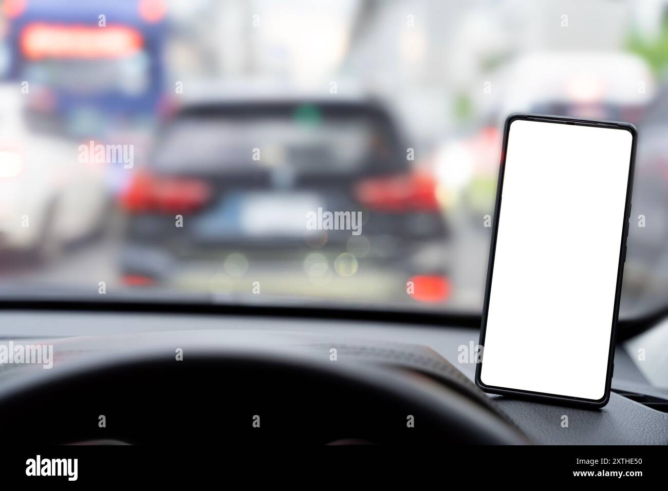 Modern smartphone device gadget mounted on phone holder at car ...