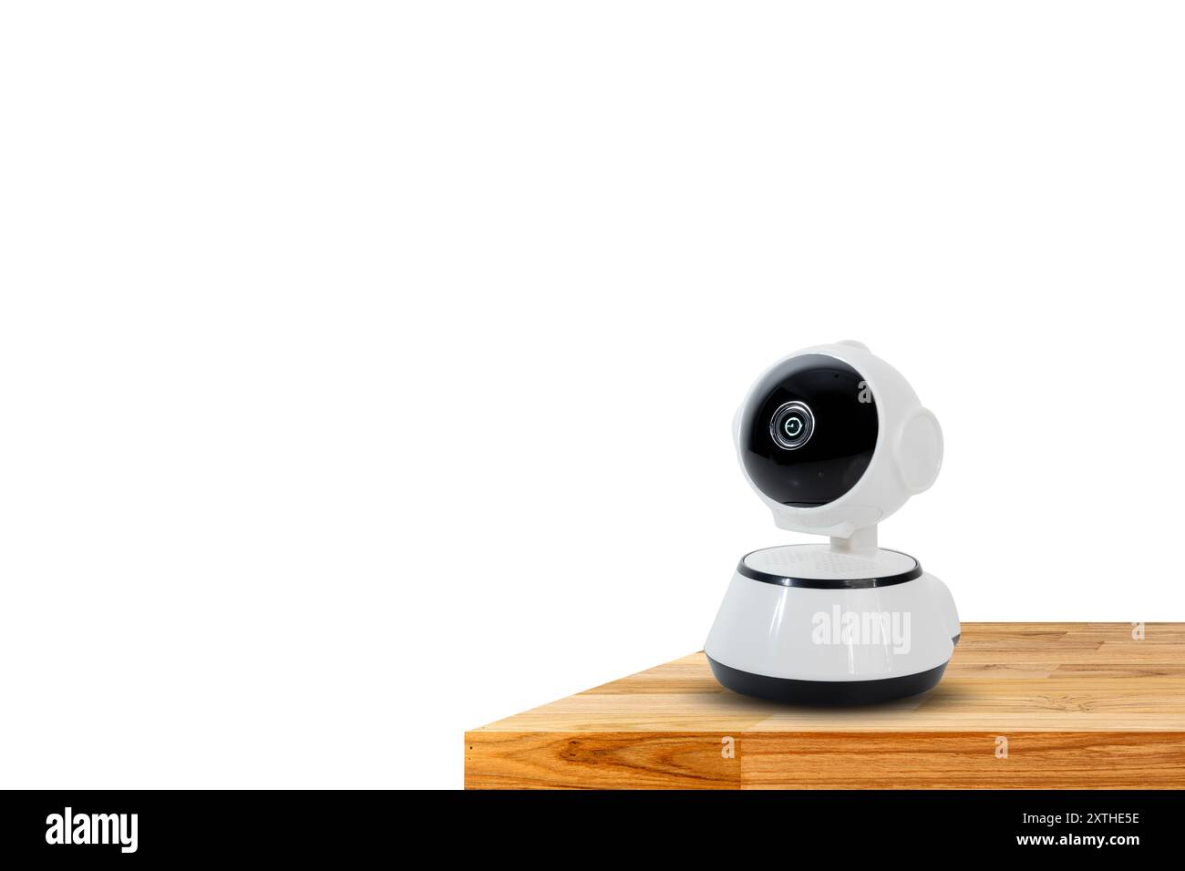 CCTV camera placed on table. Advanced white CCTV camera on wooden table ...
