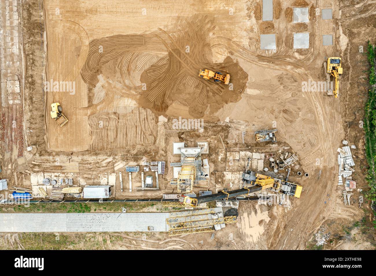 flattening and compacting of ground on building site by heavy ...