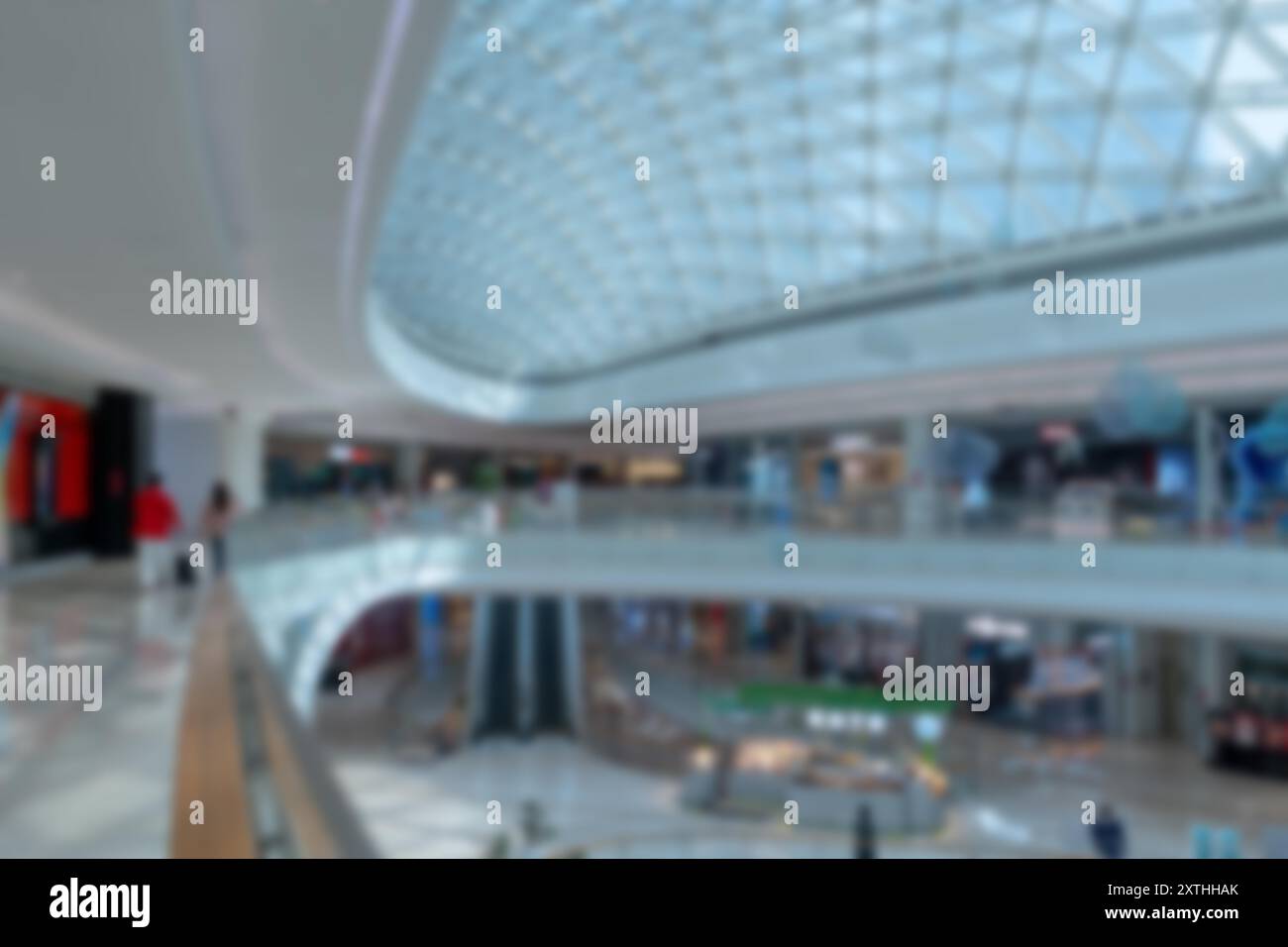 A blurred view of a shopping mall in Shenzhen, China, featuring a glass ...