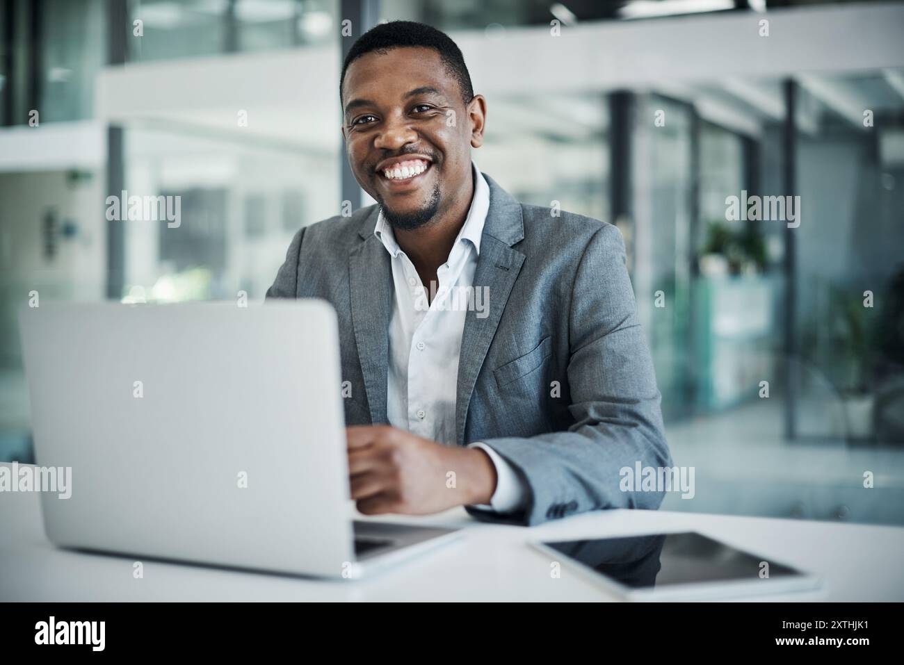 Portrait, business and black man at desk, laptop and entrepreneur with ...