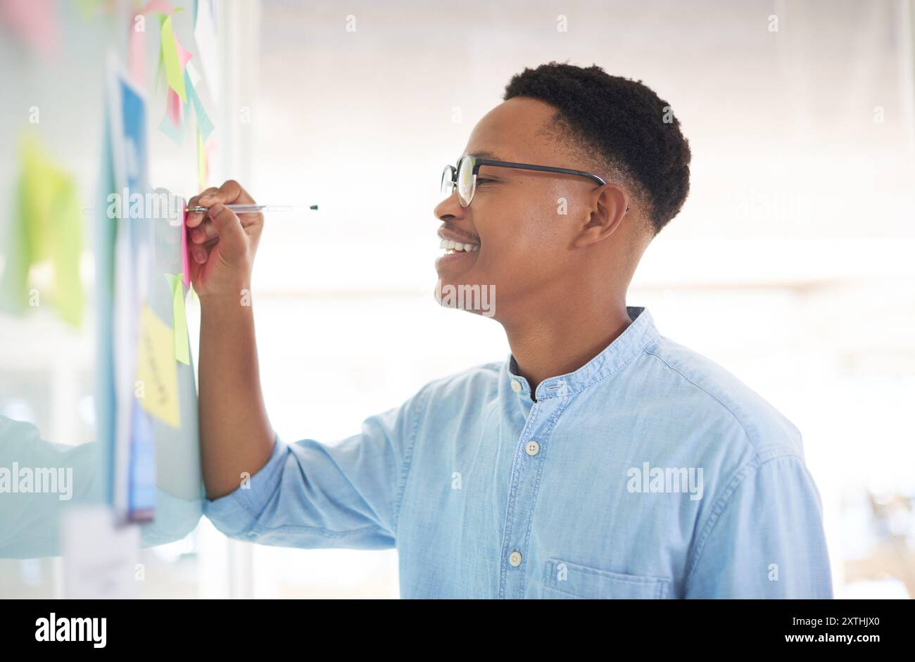 Happy black man, writing and schedule planning with whiteboard for ...