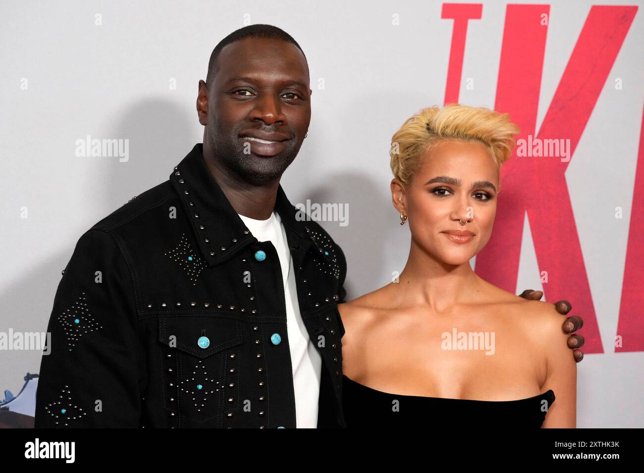 Omar Sy, left, and Nathalie Emmanuel pose together at the premiere of ...