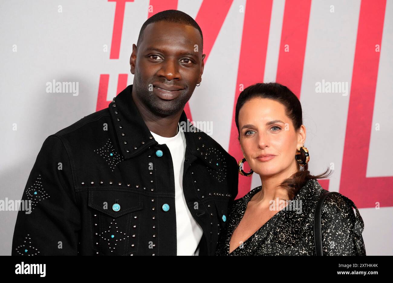Omar Sy poses with his wife Helene at the premiere of the Peacock film ...